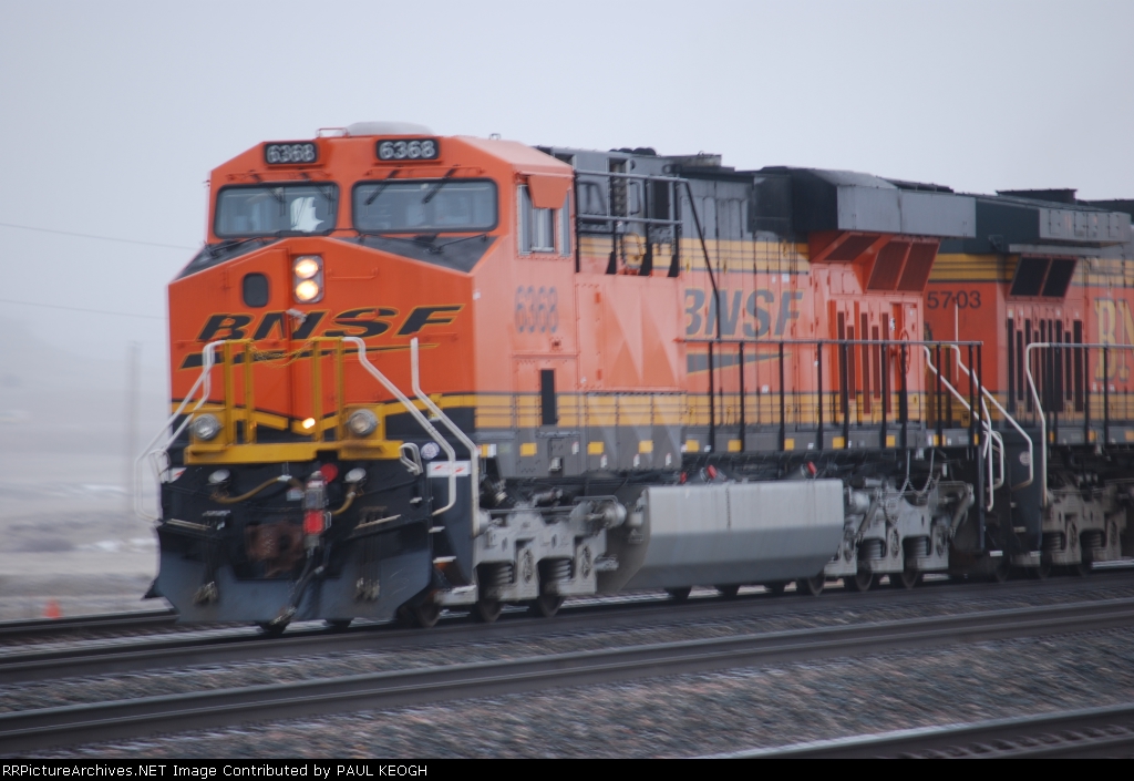 BNSF 6368 rolls east as a rear DPU in the early morning fog with a loaded coal.